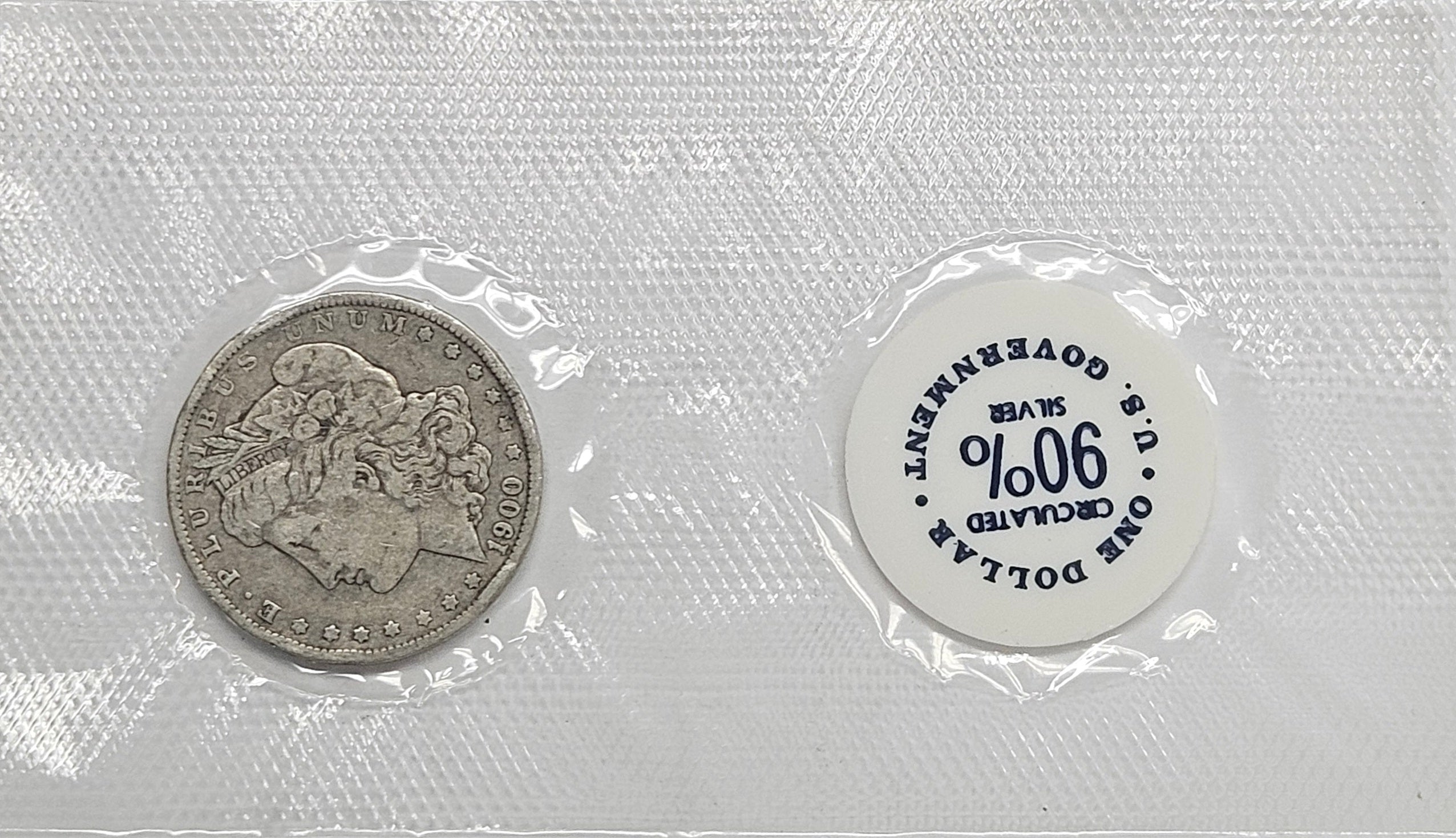 1900-O Morgan Dollar GSA Envelope Fine many rim bumps – Mount Vernon Coin